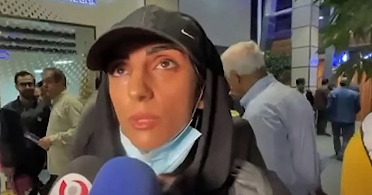 Iranian rock climber Elnaz Rekabi returns to cheering crowds in Tehran
