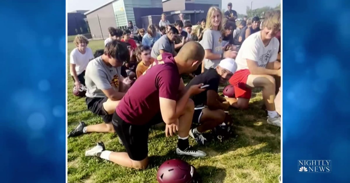 High school football player celebrates with team after learning he’s ...