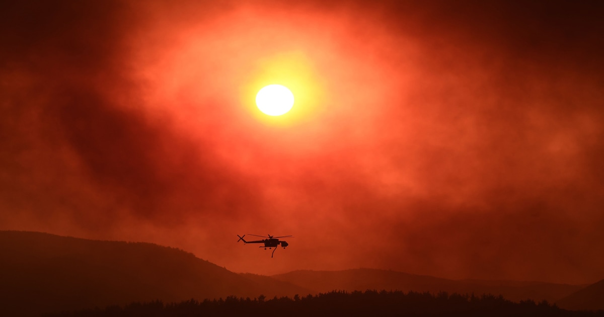 Greek firefighters battling wildfires find 18 bodies
