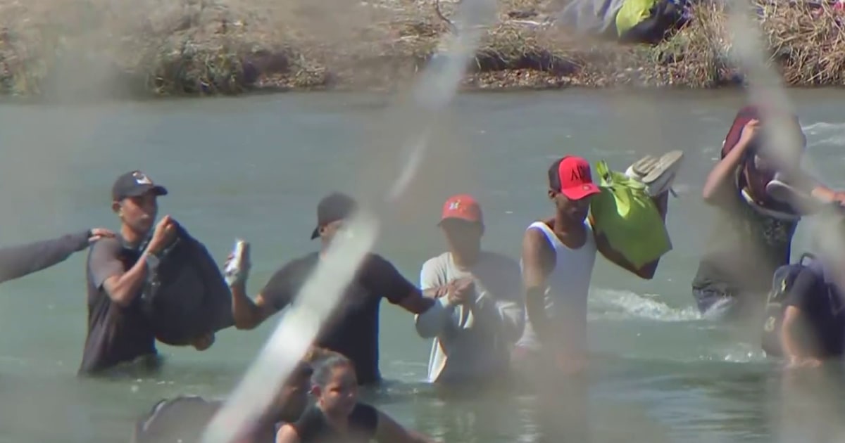 Border communities strained as crossings near record highs