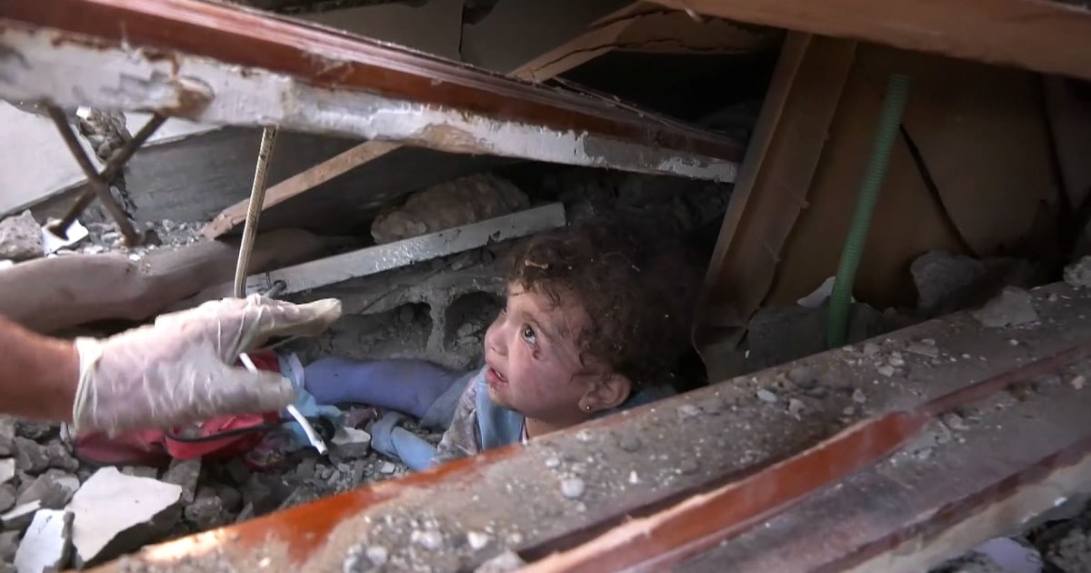 Rescue workers fight to save children trapped in Gaza City airstrike rubble
