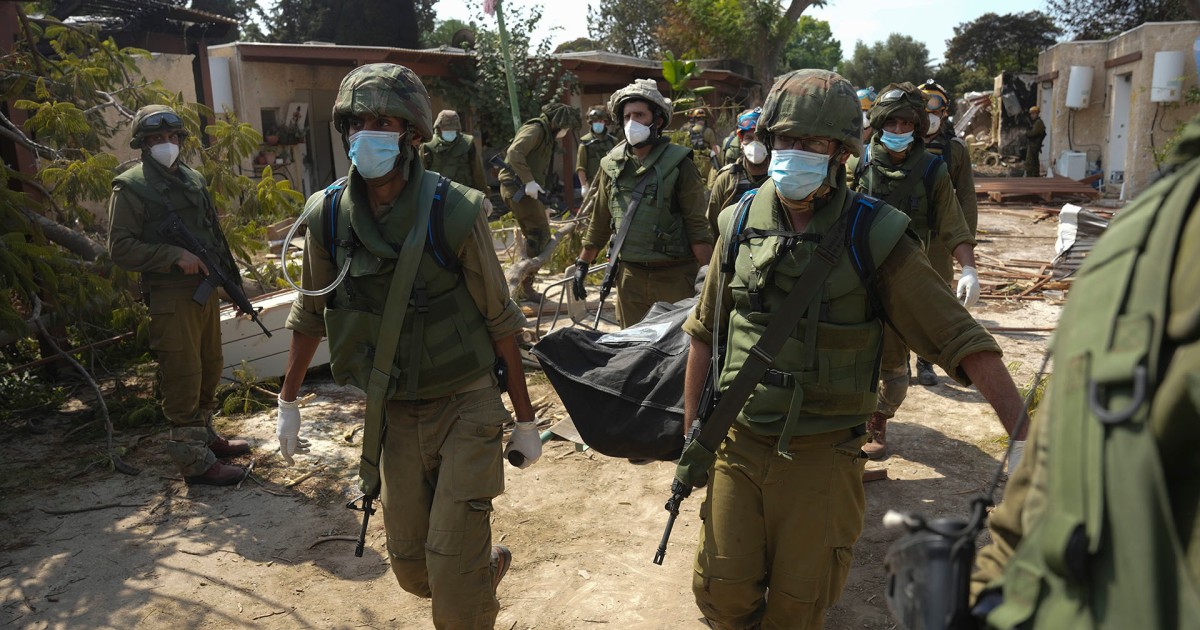Israel Defense Forces clear bodies from Kfar Azza kibbutz