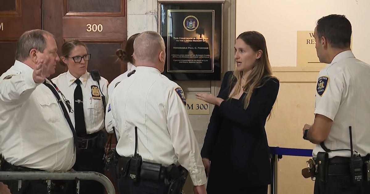 Woman escorted out after approaching Trump at New York trial