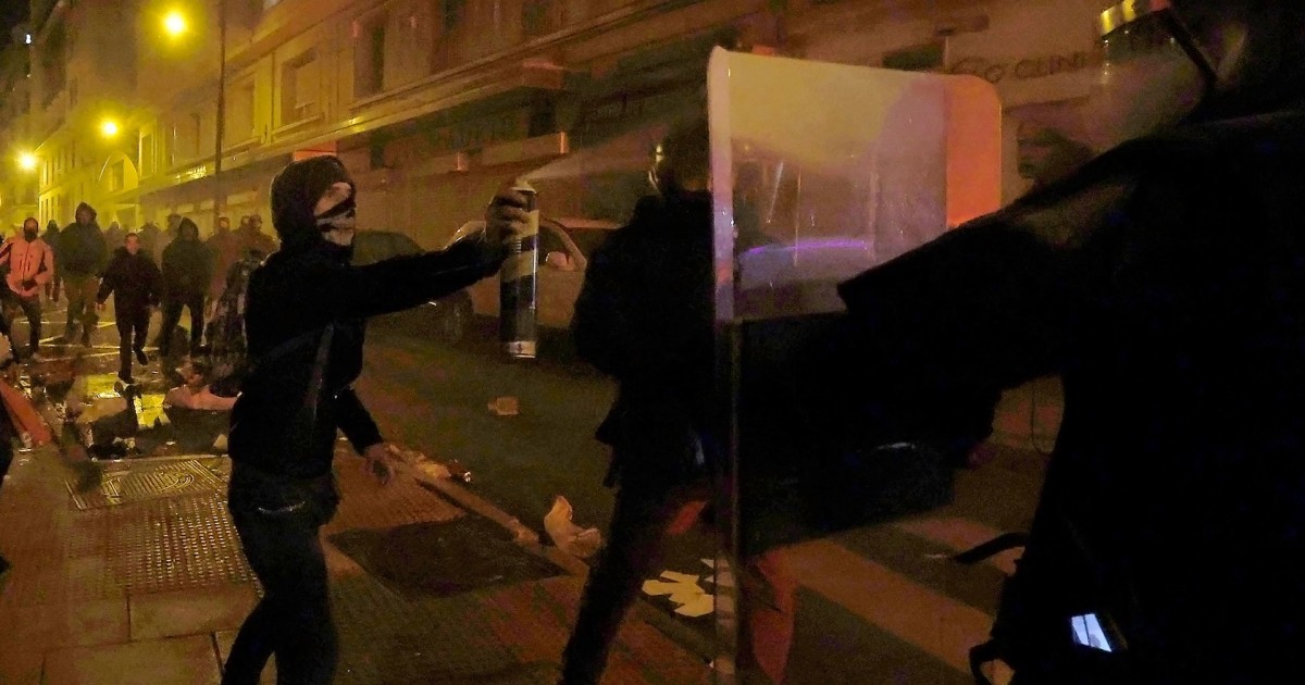 Protesters clash with police in Madrid over government deal with ...