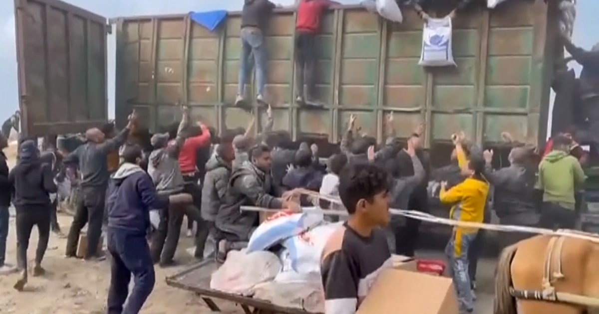 Video shows aid trucks surrounded by crowds near Gaza City
