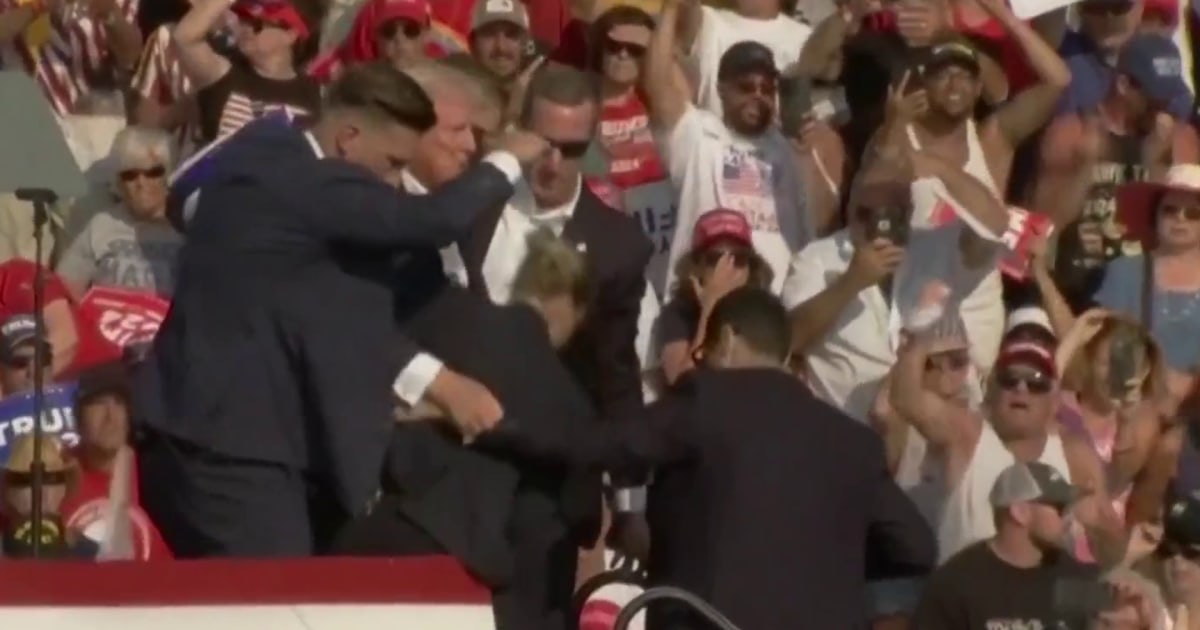 Suspect tentatively identified, security questions surround ...