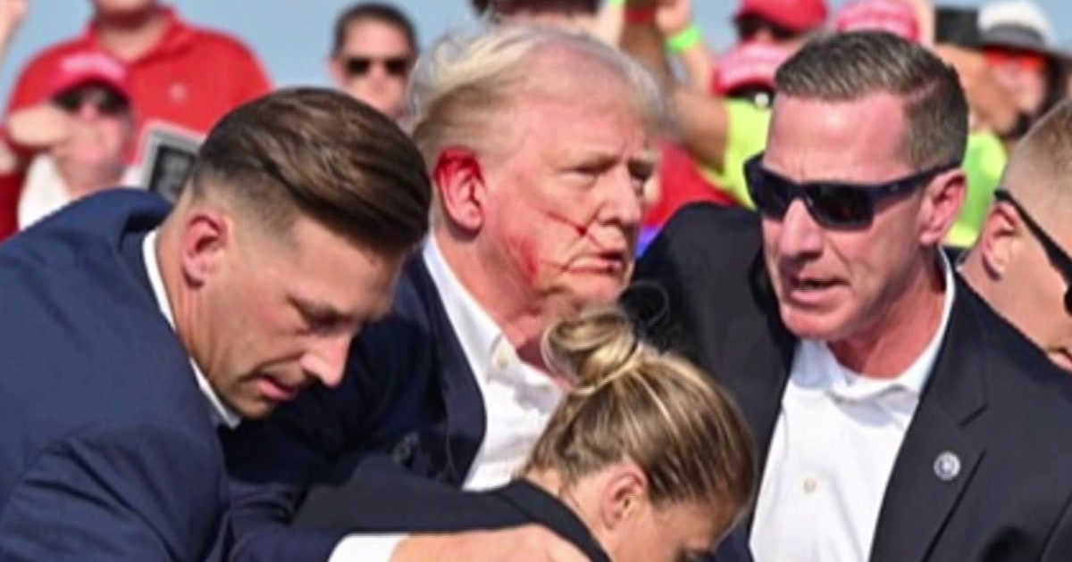 Photographer at rally says bullet took out piece of Trump's ear