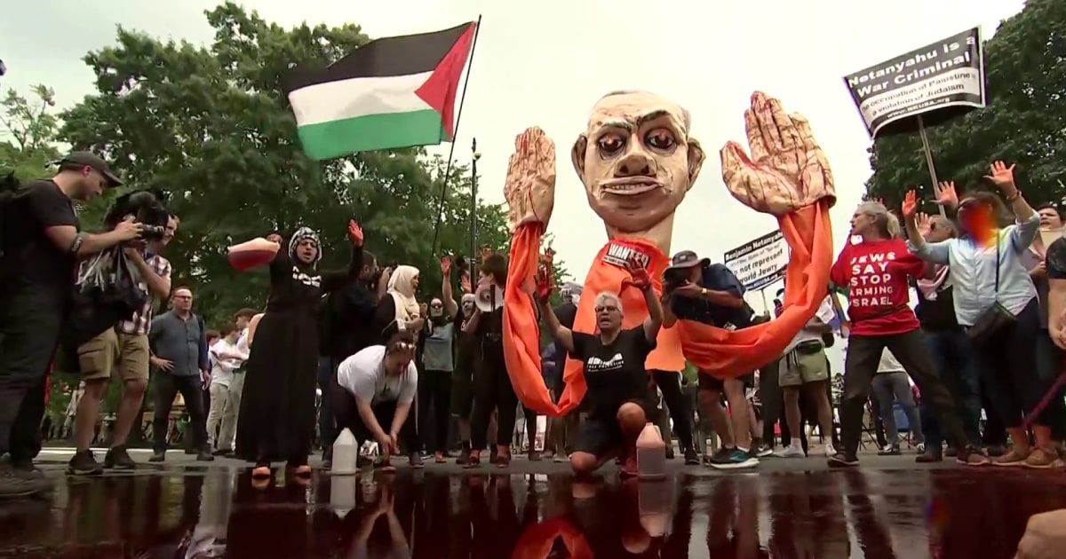 Protesters pour 'blood' near White House ahead of Biden's meeting with ...