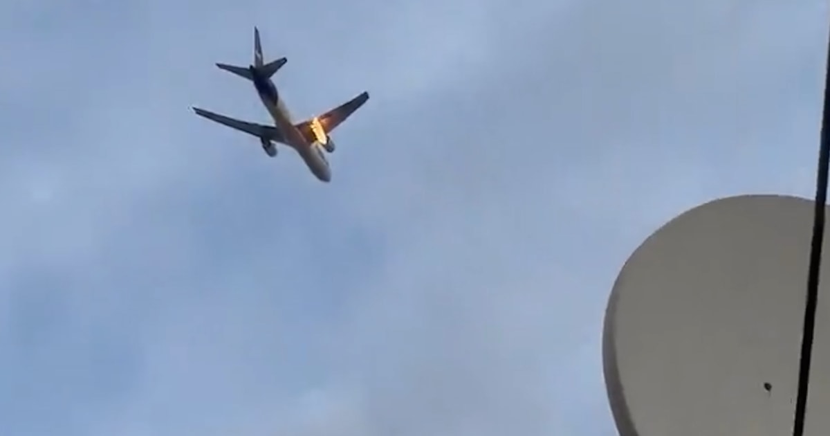 Videos show FedEx cargo plane's engine on fire mid-flight