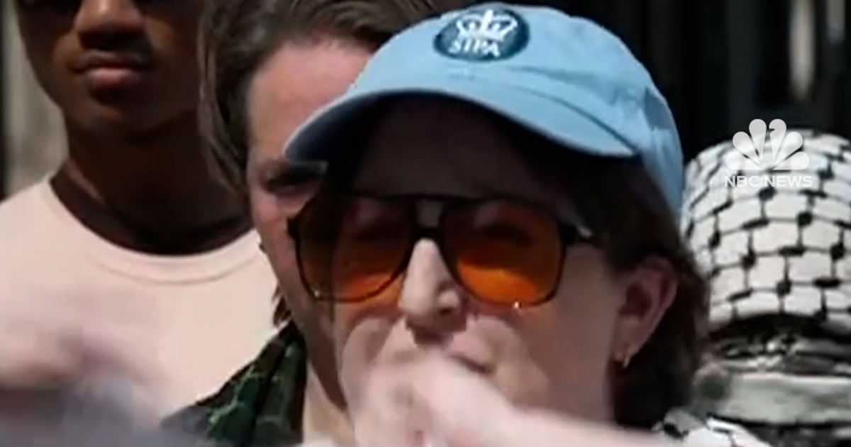 Alumni from Columbia University rip up their diplomas