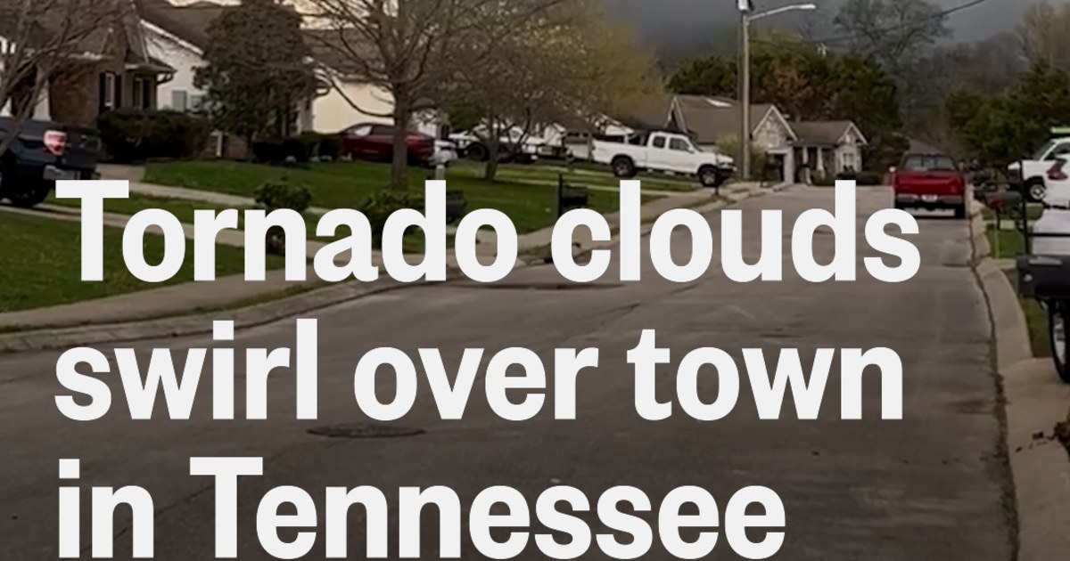 Tornado clouds sweep over Tennessee neighborhood