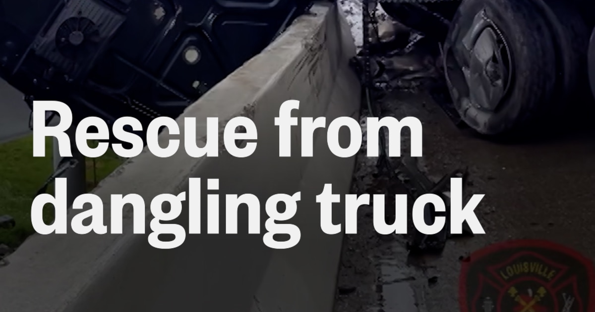 Driver rescued from truck dangling over highway