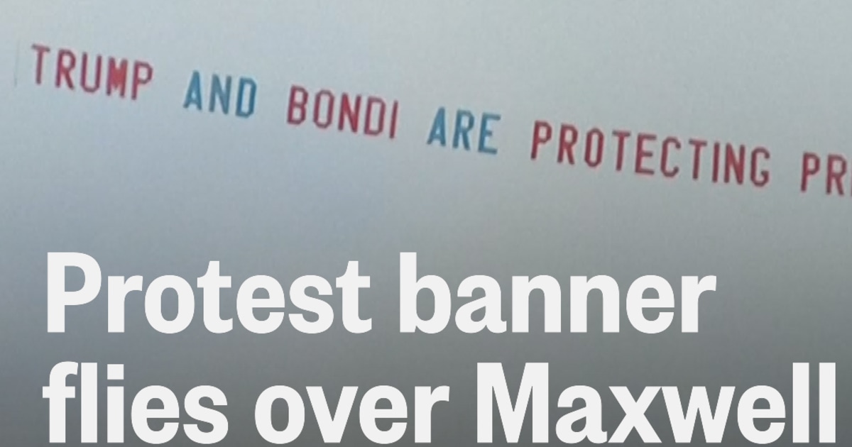 Protest banner flies over Maxwell DOJ meeting