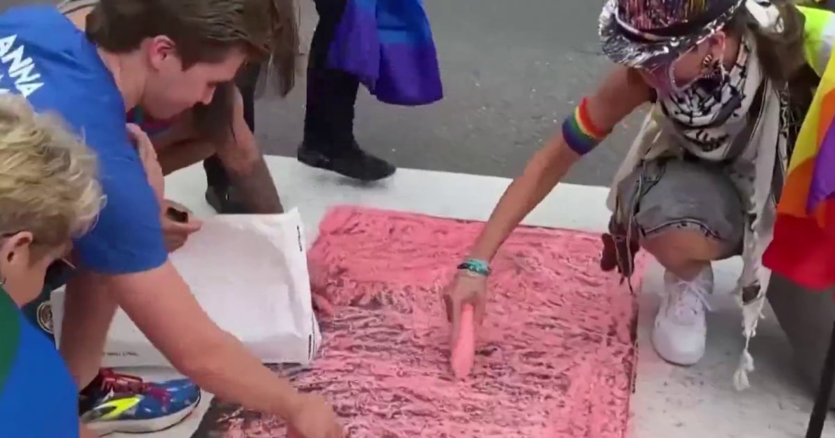 Volunteers use chalk to restore crosswalk honoring Pulse shooting victims
