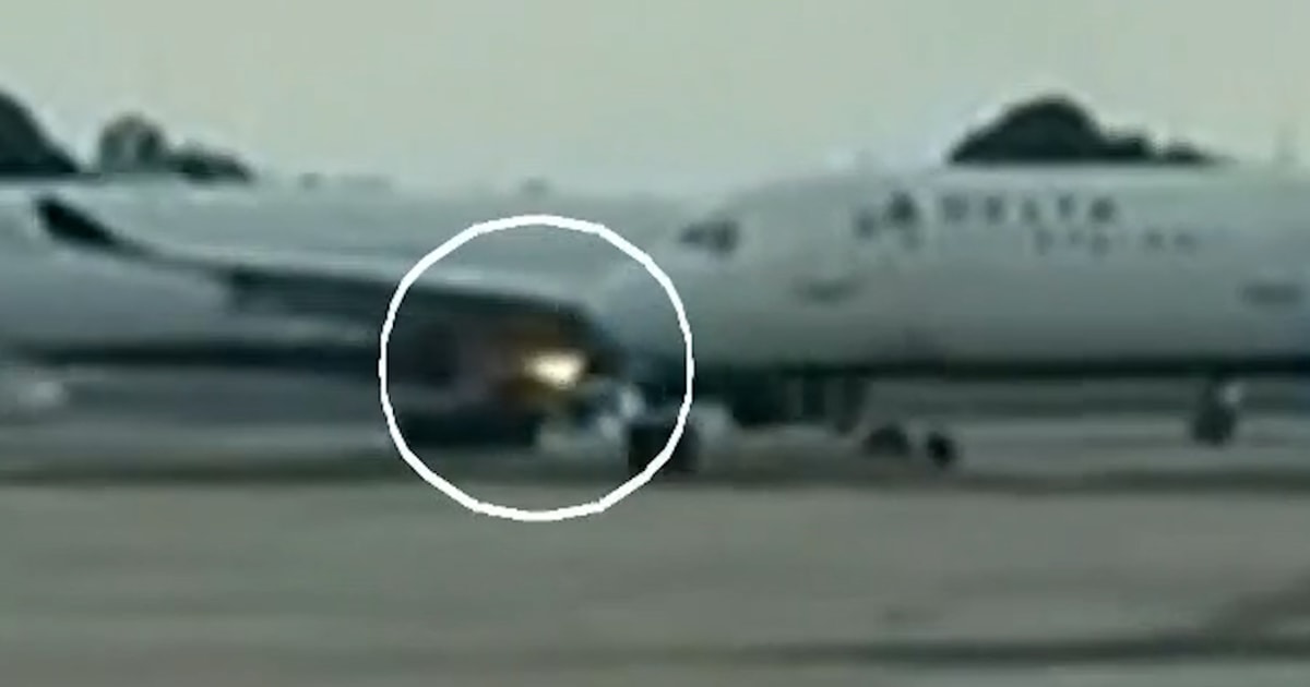 Delta plane engine catches fire on airport runway