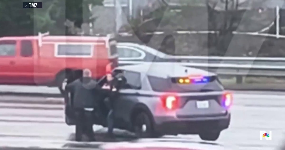 Police in Washington say suspect dragged lieutenant, stole car before chase