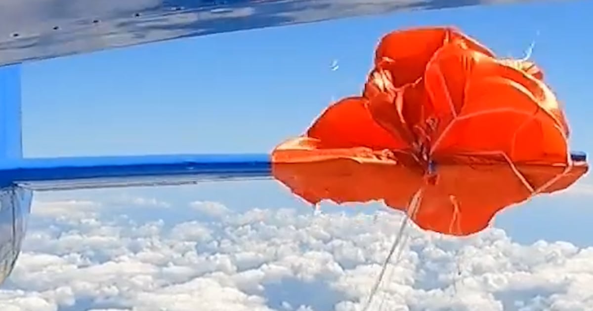 Skydiver's parachute gets caught on plane tail