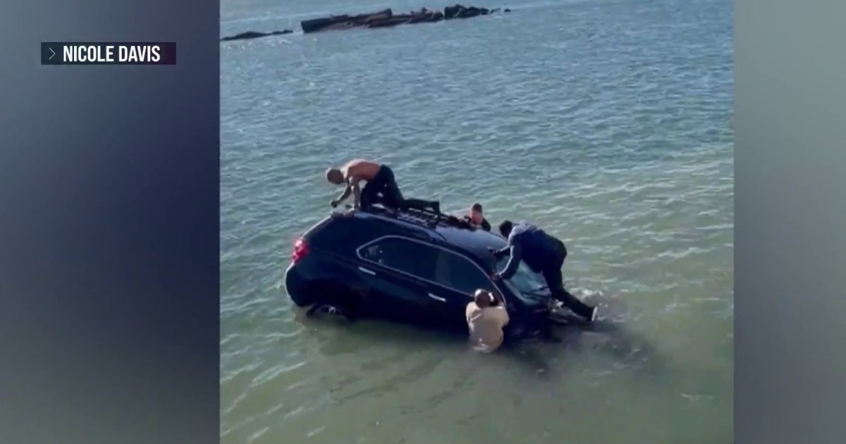 Dramatic rescue after woman drives car into frigid water