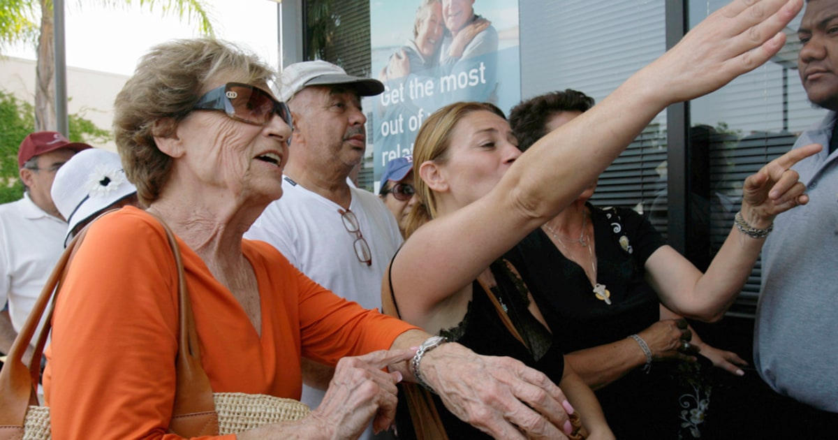 Police watch irate customers outside IndyMac