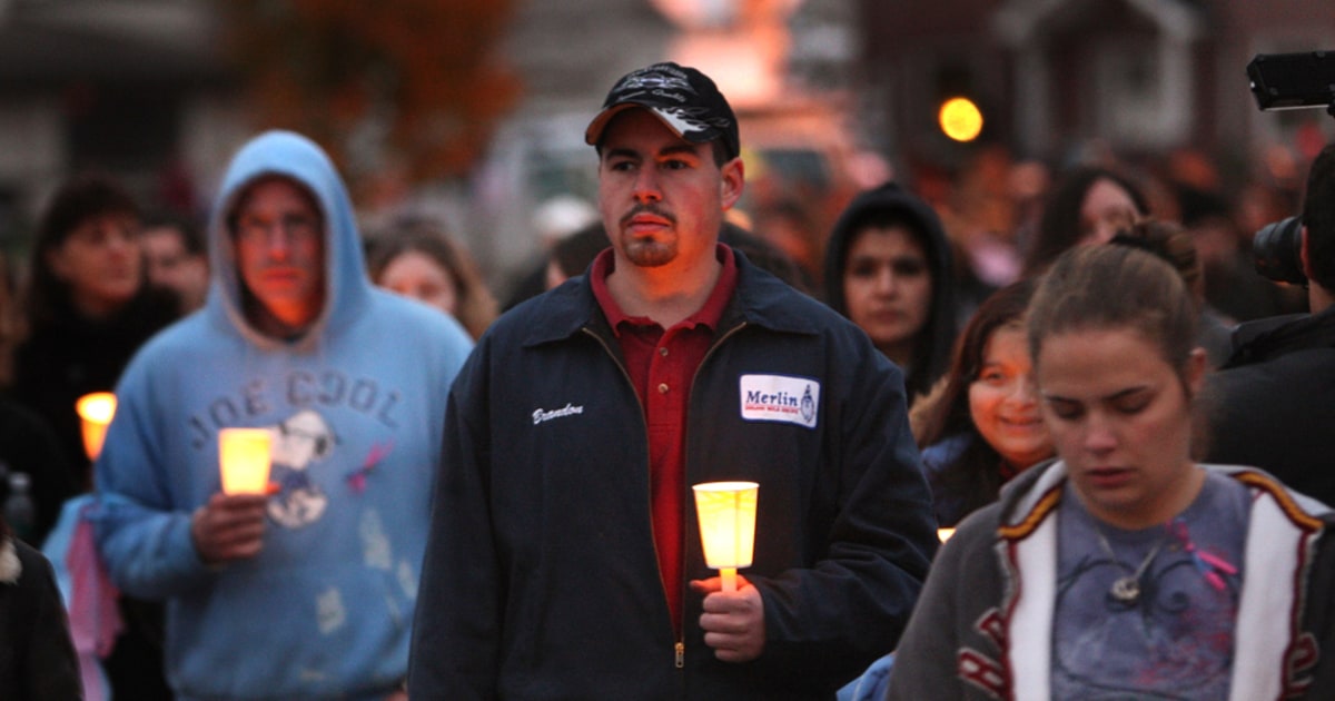 Vigil held for missing wife at home of ex-cop