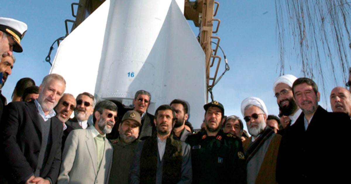 Iran unveils space center, launches rocket