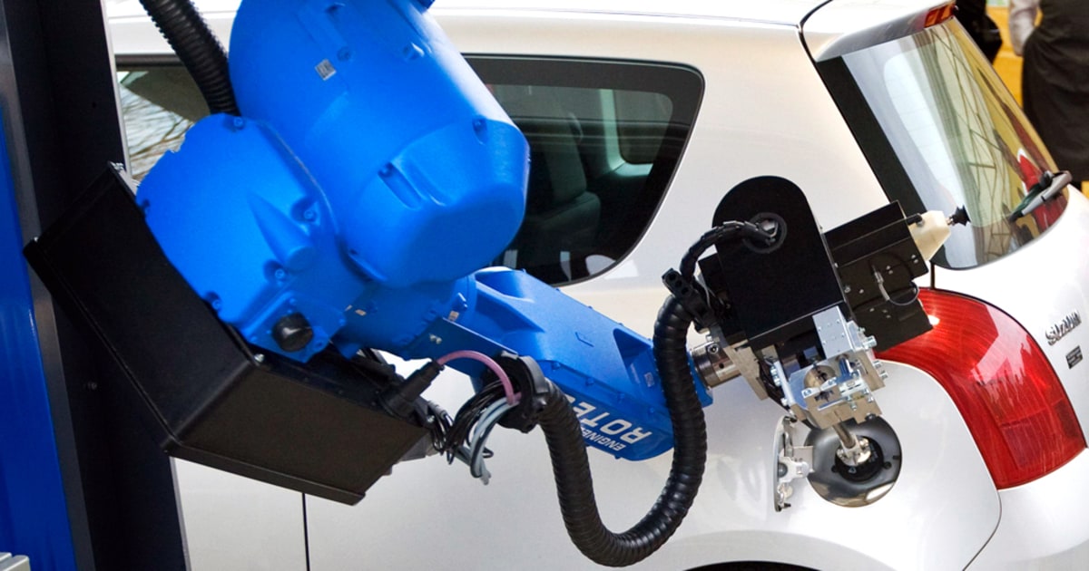Inventors unveil robot to fill car gas tank