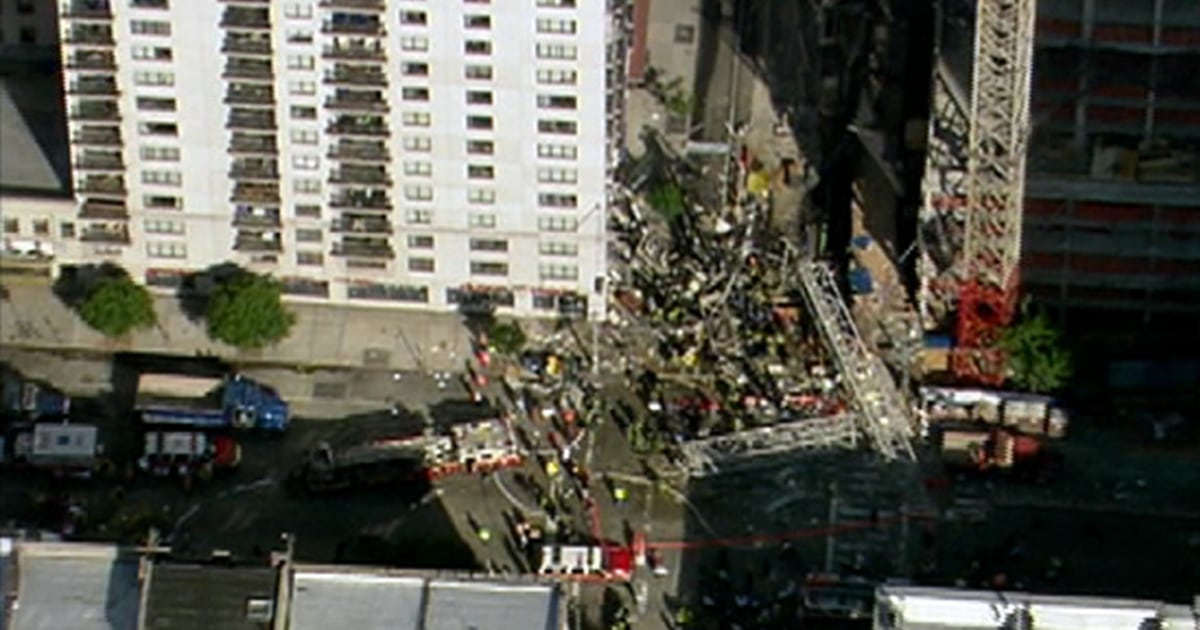 Residents return to site of crane collapse