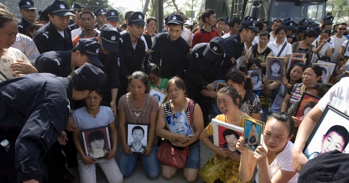 Chinese police pull parents away from protest