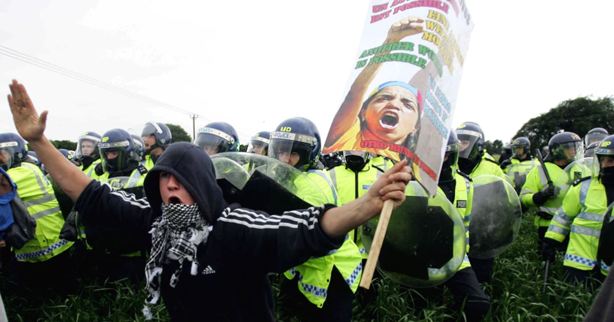 Protesters, riot police clash near G-8 summit