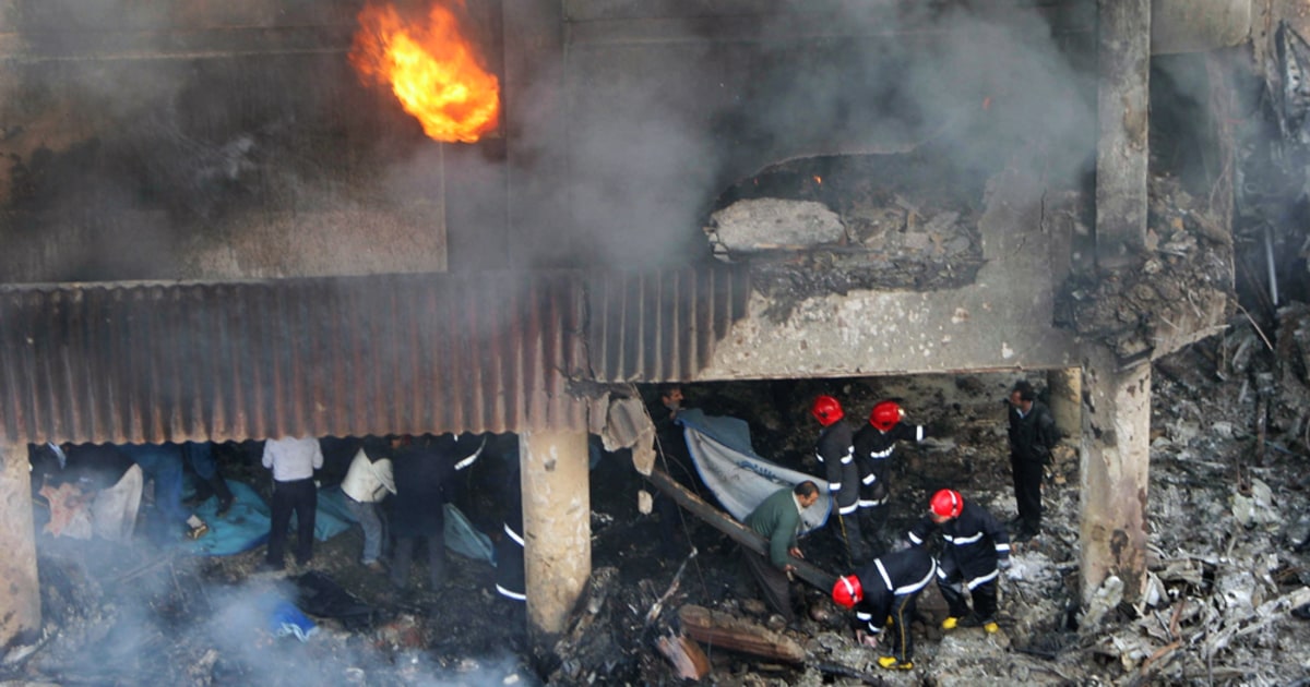 Iranian military plane hits building, killing 115