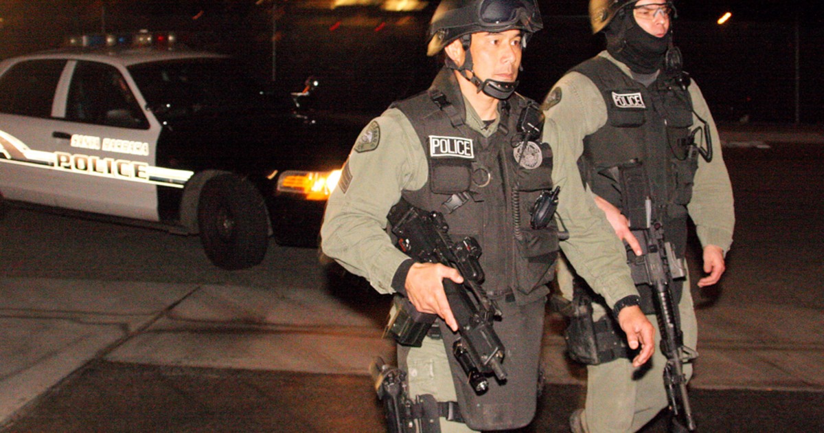 Police look for motive in deadly postal shooting