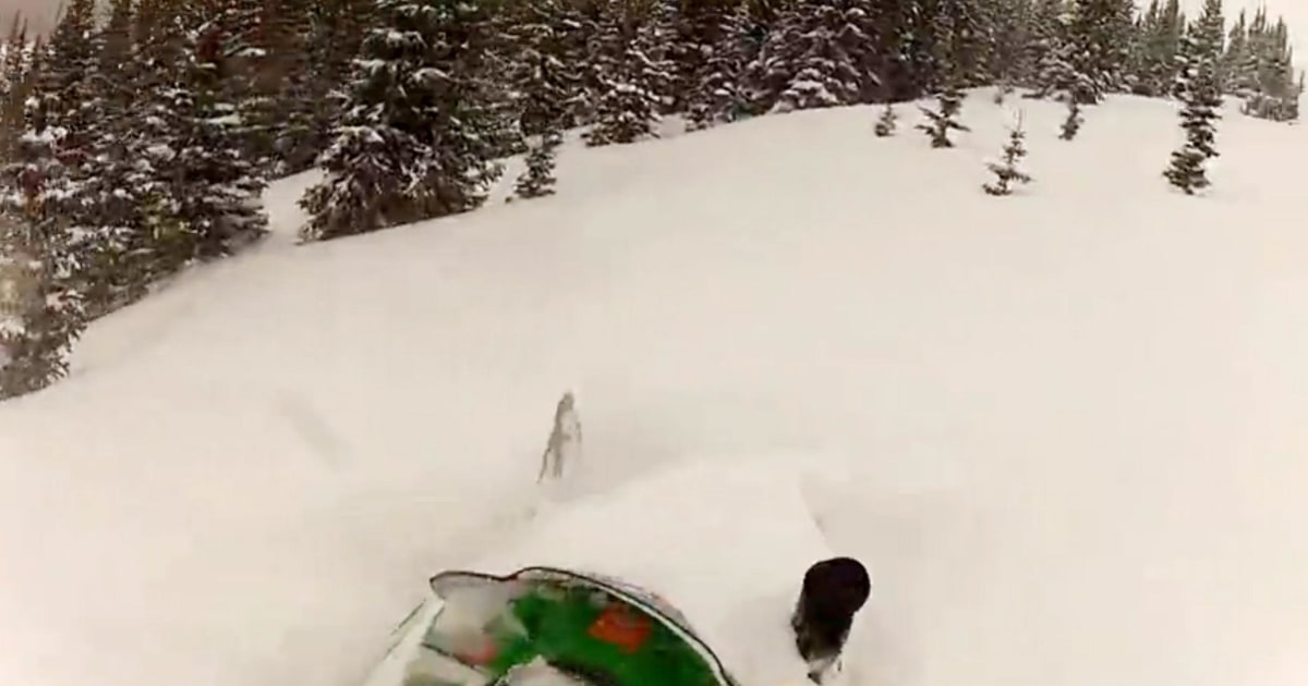 Watch as Snowmobiler Survives an Avalanche