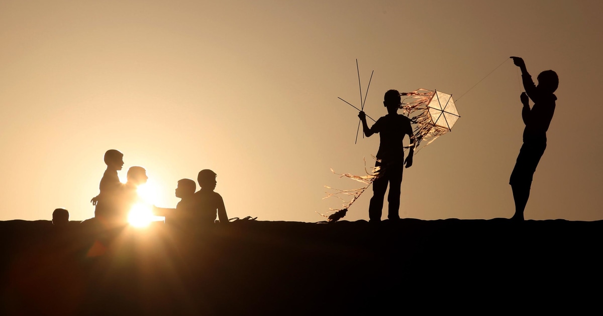 Kites Catch the Wind as Sun Sets on Refugee Camp