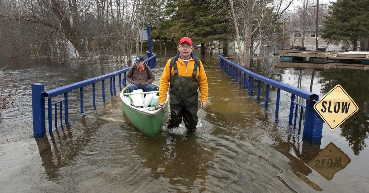 Bridge Under Troubled Waters: Canoe Crosses Flooded River