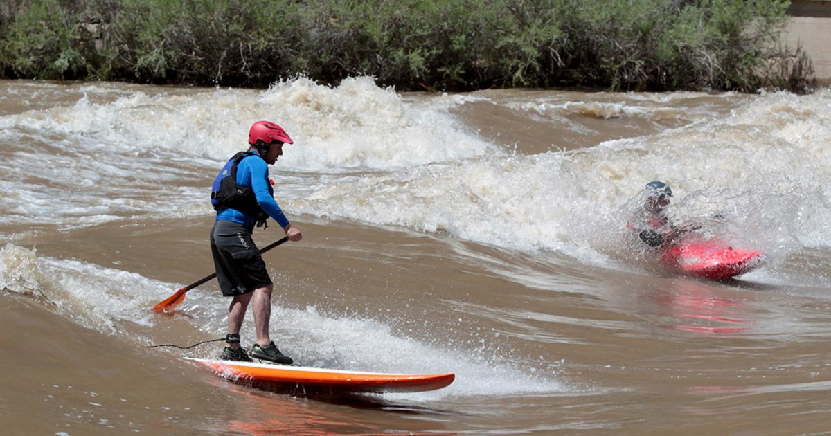 Surfers, Kayakers Ride Wave in the Colorado River
