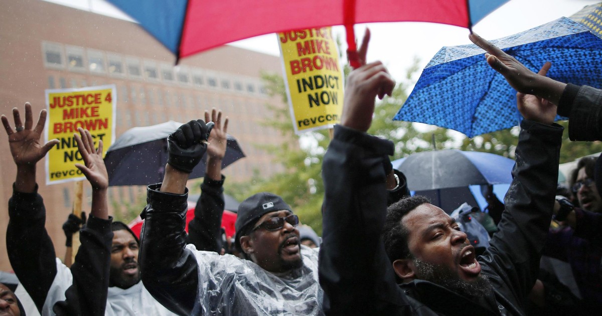 Braving Rain, Protesters Call for Justice for Michael Brown