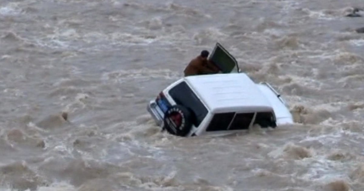 Watch Rescuers Pull Flood-Stranded Driver to Safety