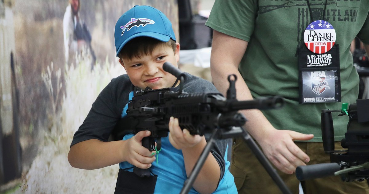 Gun Fans Admire Weapons at NRA Meeting in Louisville