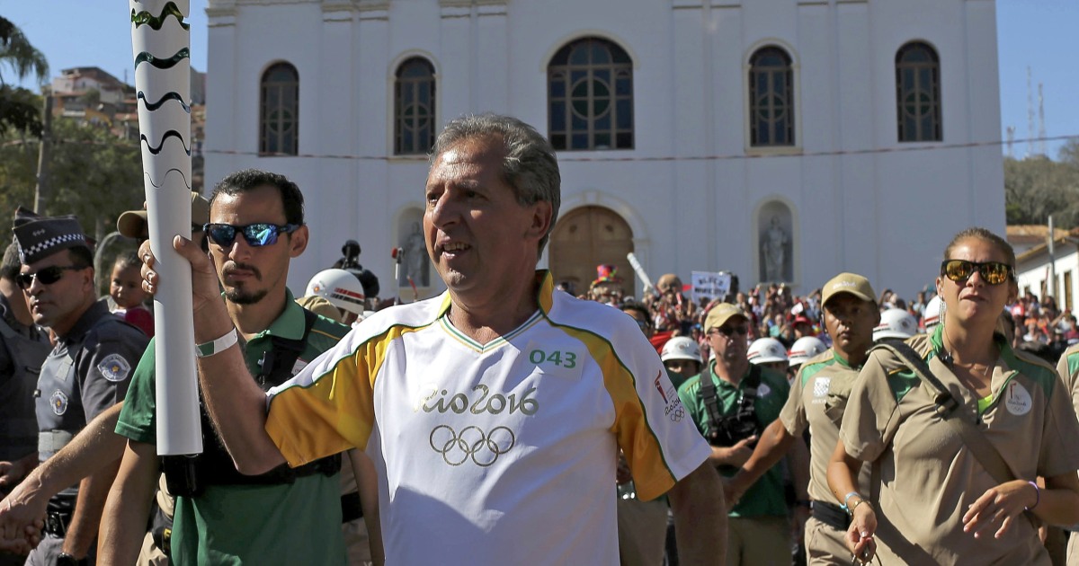 Olympic Torch Met by Protests in Rio Town
