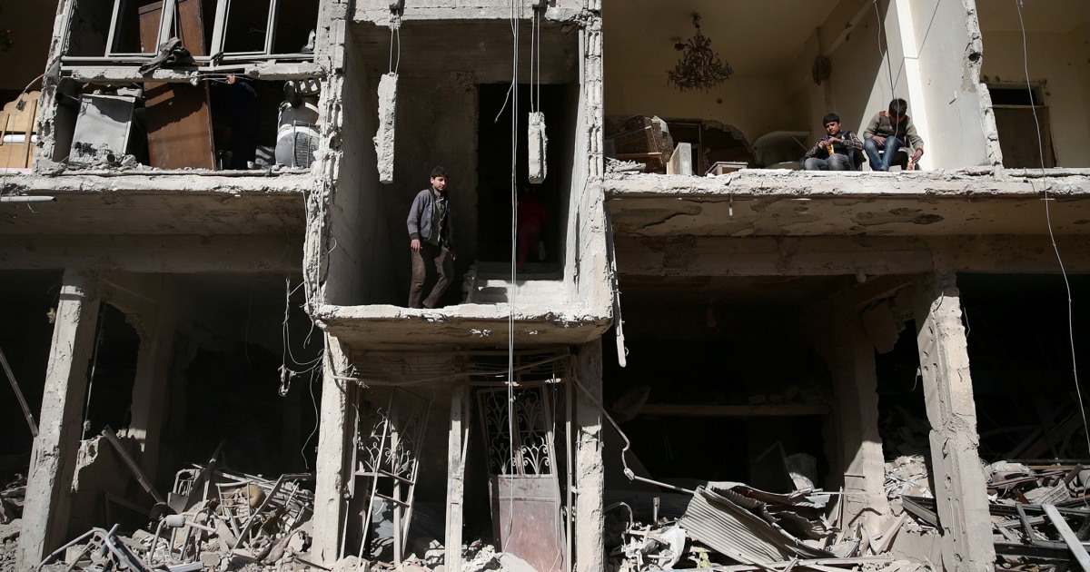 Tuesday in Pictures: Syrian Buildings Fall After Shelling