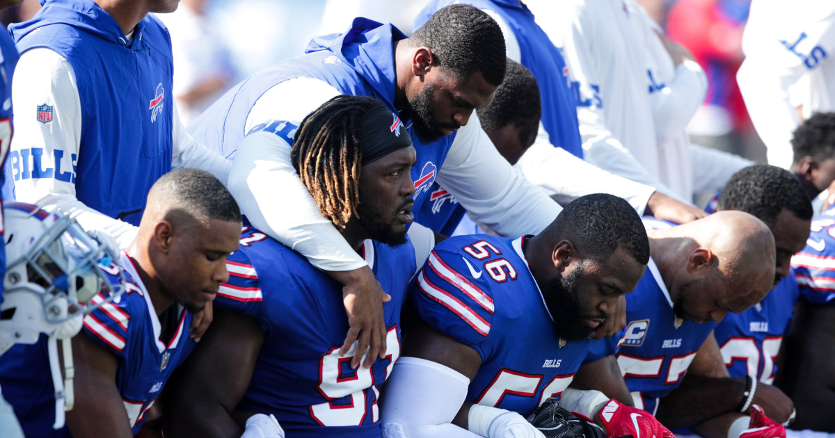NFL Players Link Arms, Kneel After Trump Criticizes Protests