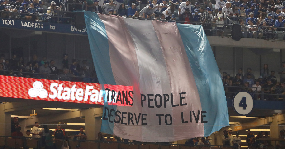 Protesters unfurl giant transgender-rights banner at World Series
