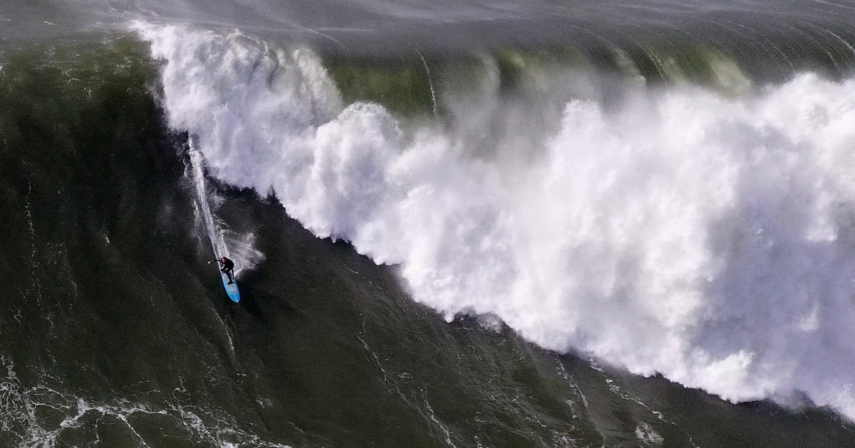 Storms shatter records in the East, create massive waves in the West