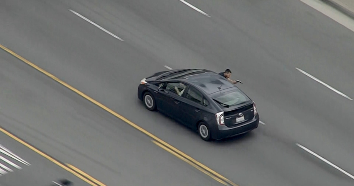 Man hanging out car window fires gun with officers in pursuit