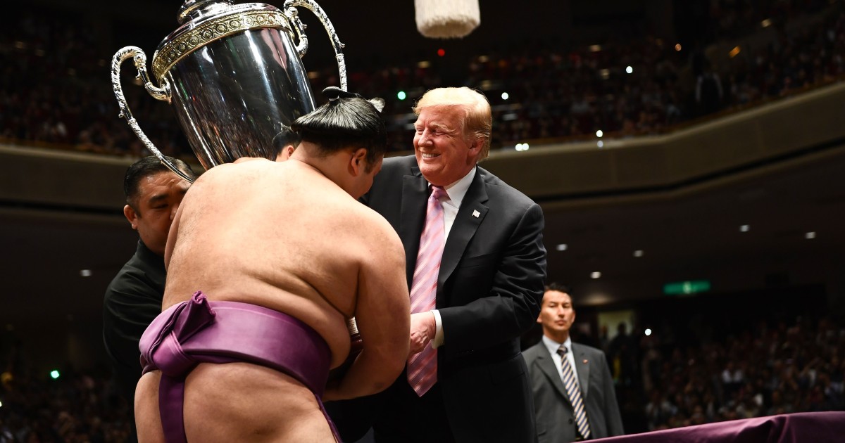 Trump awards sumo trophy as Tokyo charm offensive continues