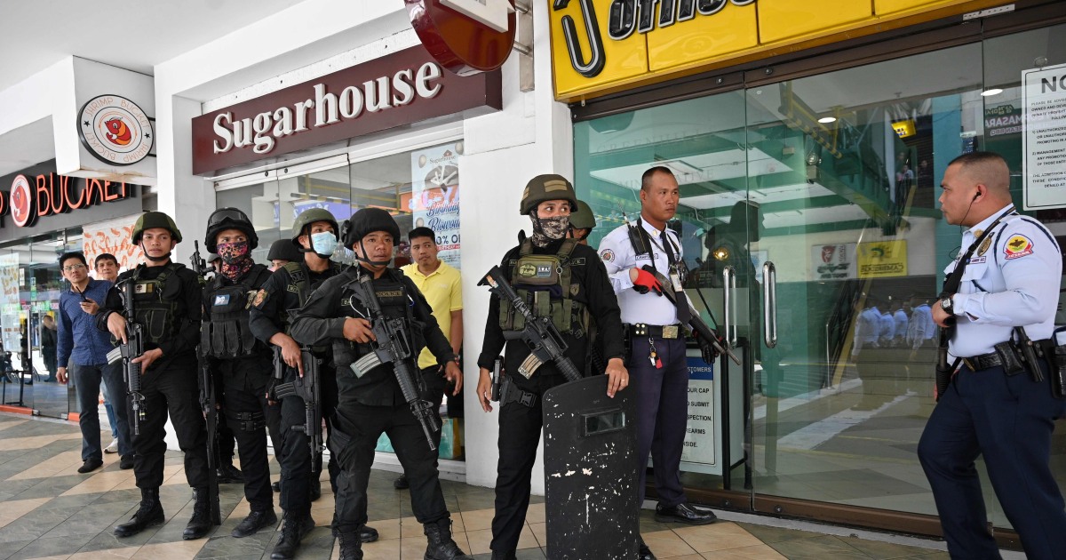 Philippine mall hostages: Disgruntled ex-guard surrenders after holding ...