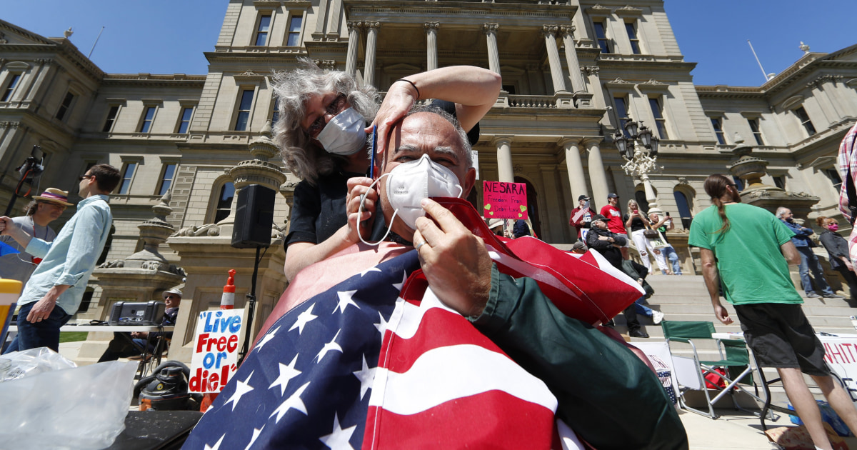 Anti-lockdown demonstrators trade guns for scissors at Michigan ...