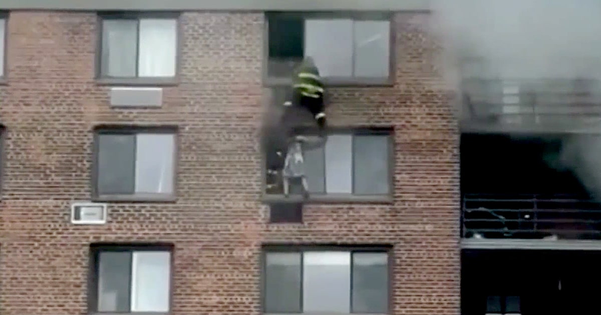 Video shows NYC firefighter rappel down building to save woman on 16th ...