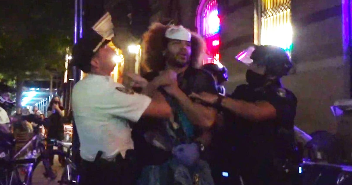 NYPD officers charge at group of protesters and diners, arresting ...