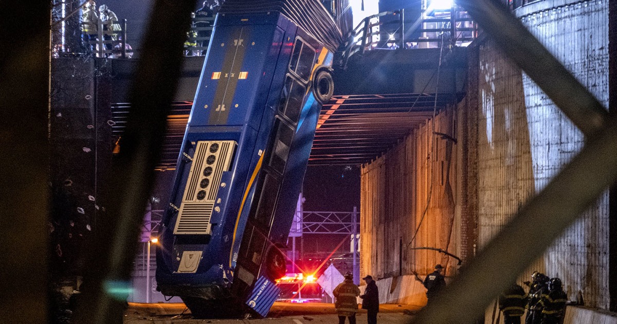 New York City bus left hanging from overpass after crash, injuring 8